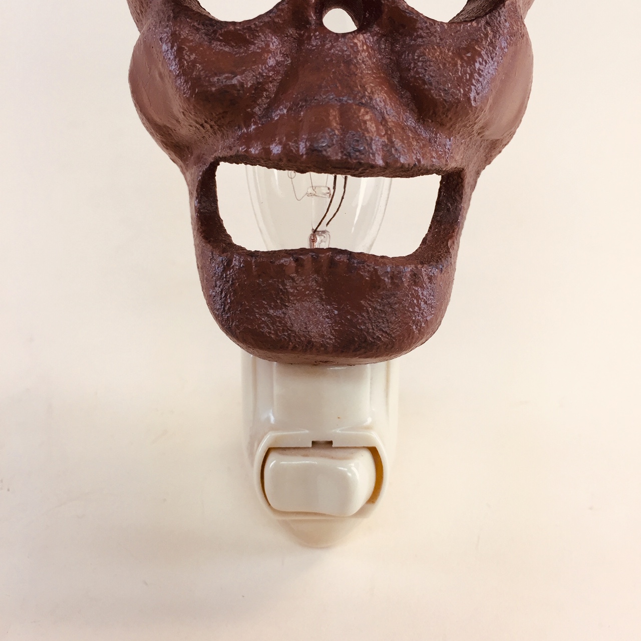 Vintage night light with cast iron skeleton head - Old Lamps & Things, LLC