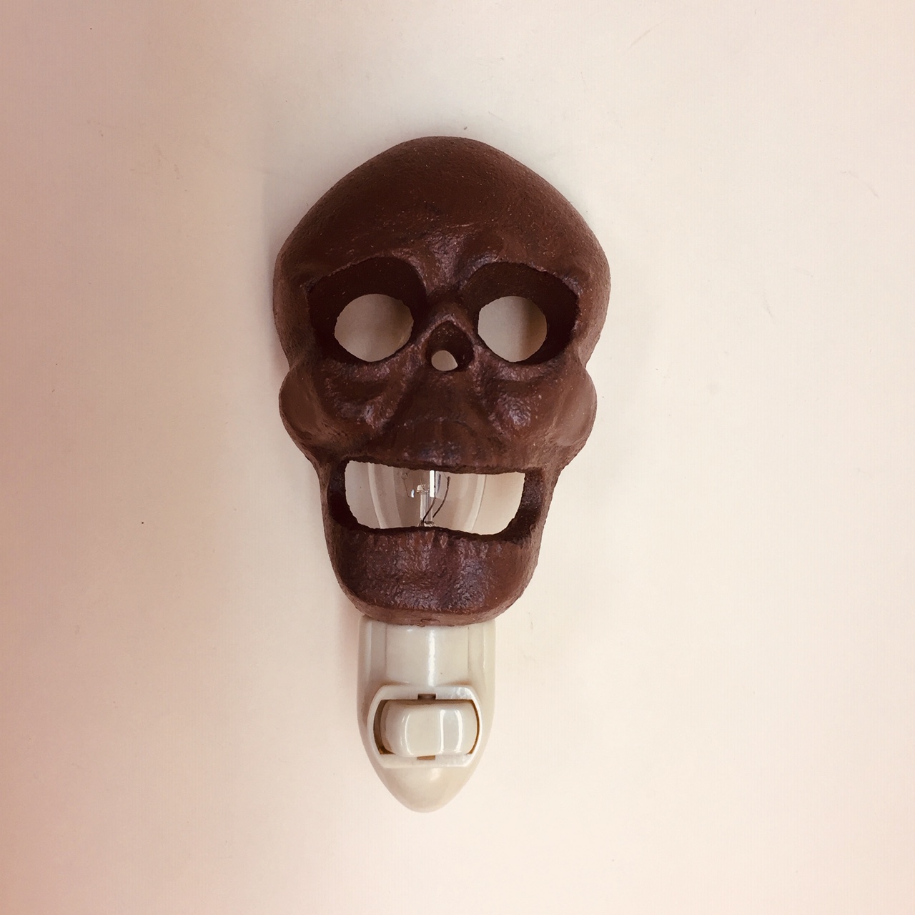 Vintage night light with cast iron skeleton head - Old Lamps & Things, LLC